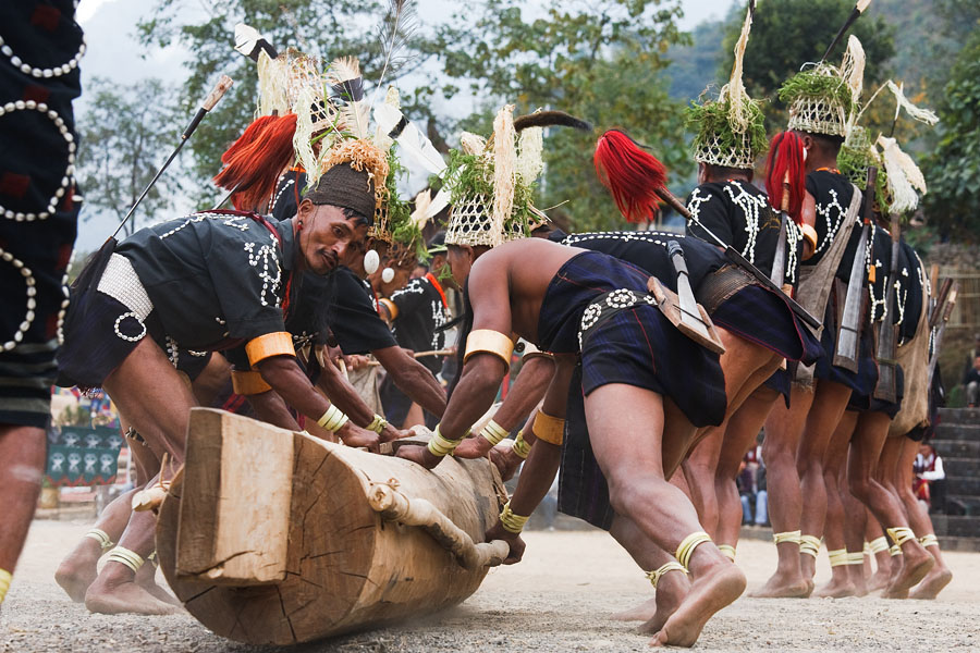 Tribesmen of the Chang tribe with their log drum